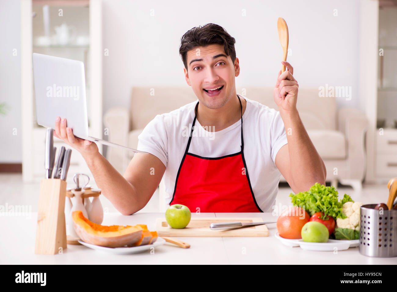 Funny man cook working in the kitchen Stock Photo - Alamy