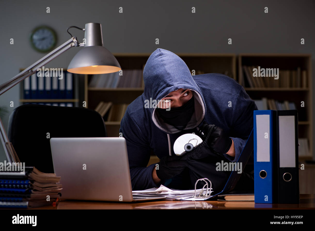 Hacker stealing personal data from home computer Stock Photo - Alamy