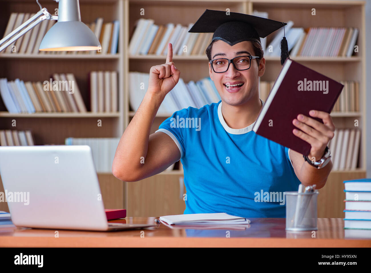 Young man graduating from university Stock Photo - Alamy
