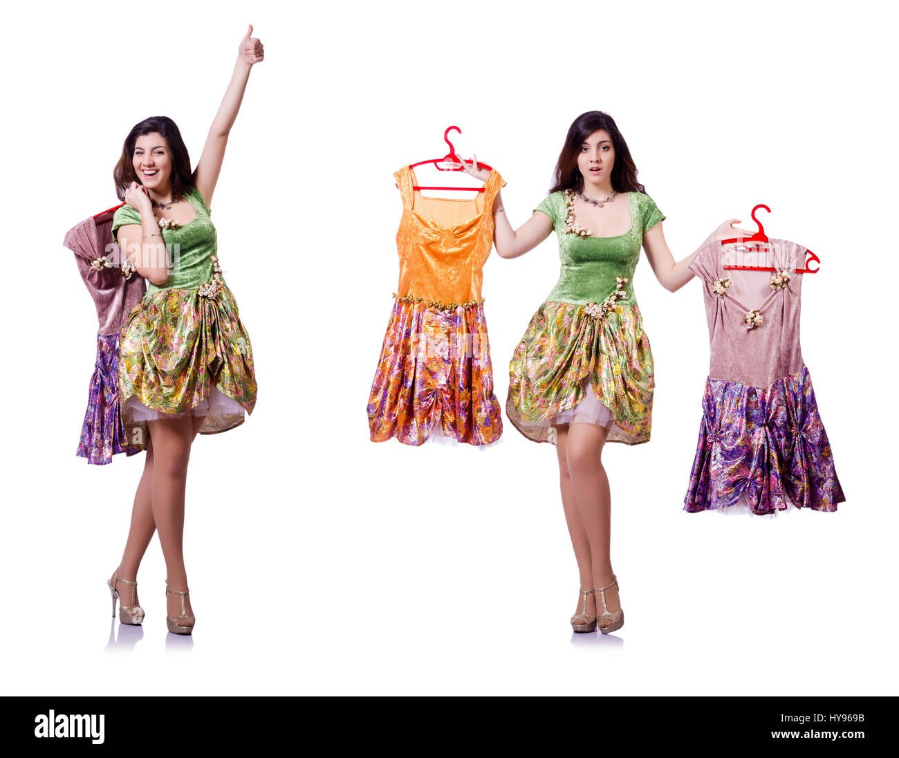 Woman trying to choose dress on white Stock Photo - Alamy