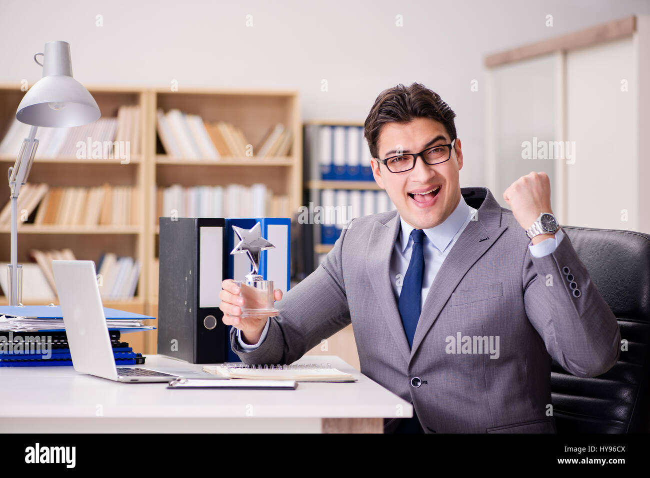 Businessman receiving award in the office Stock Photo - Alamy