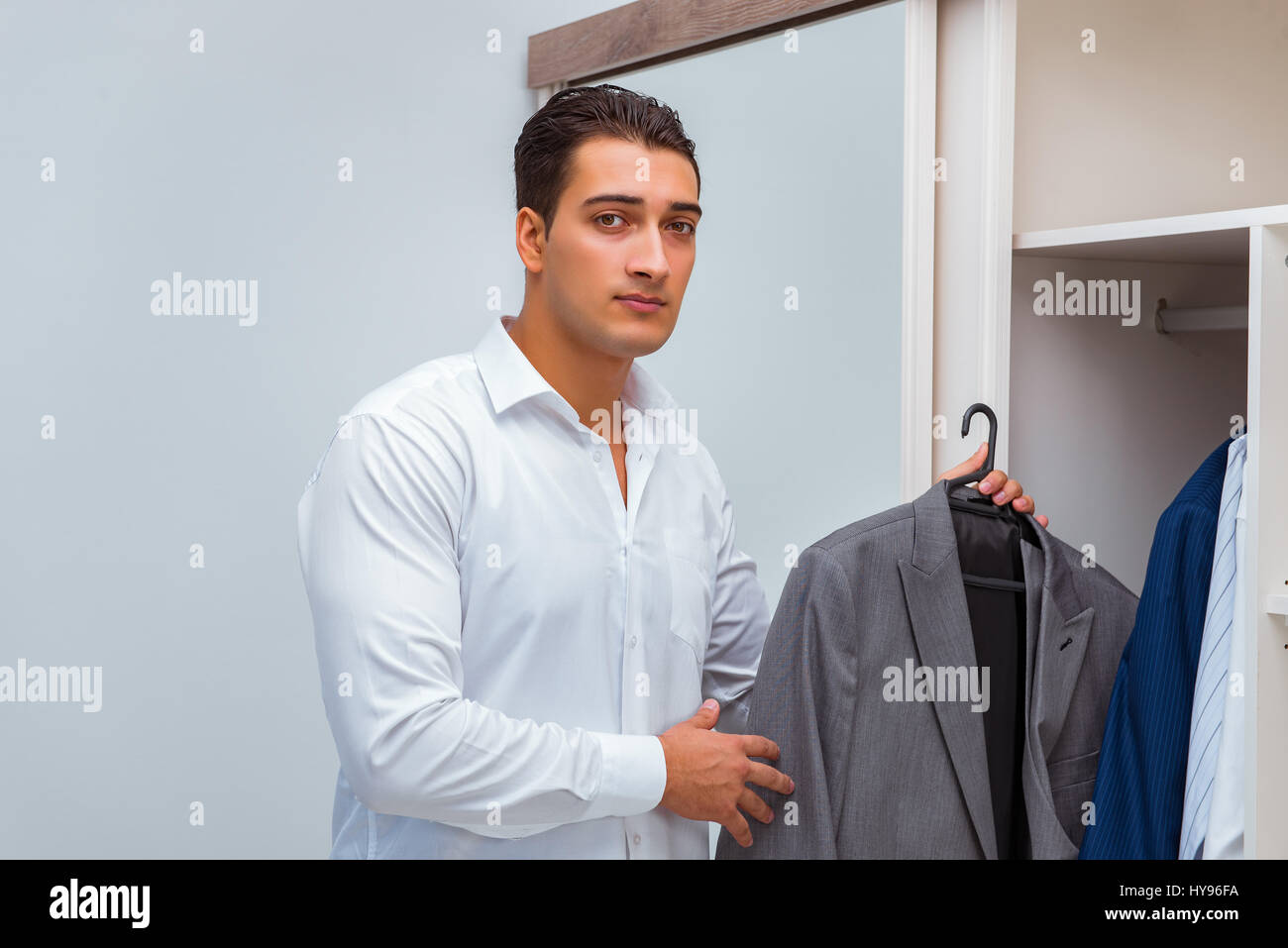 Businessman dressing up for work Stock Photo - Alamy