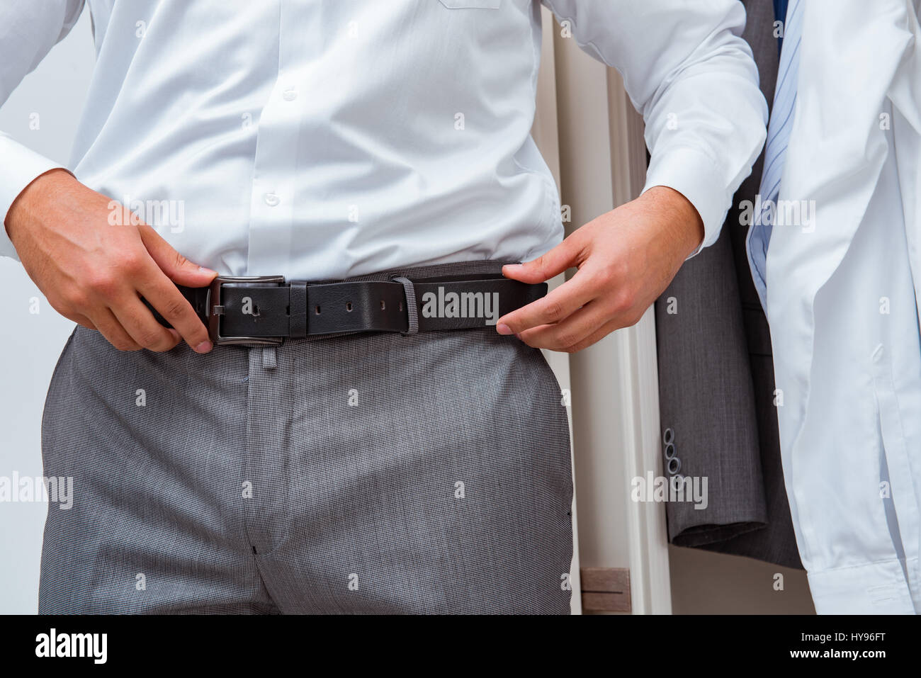 Businessman dressing up for work Stock Photo - Alamy