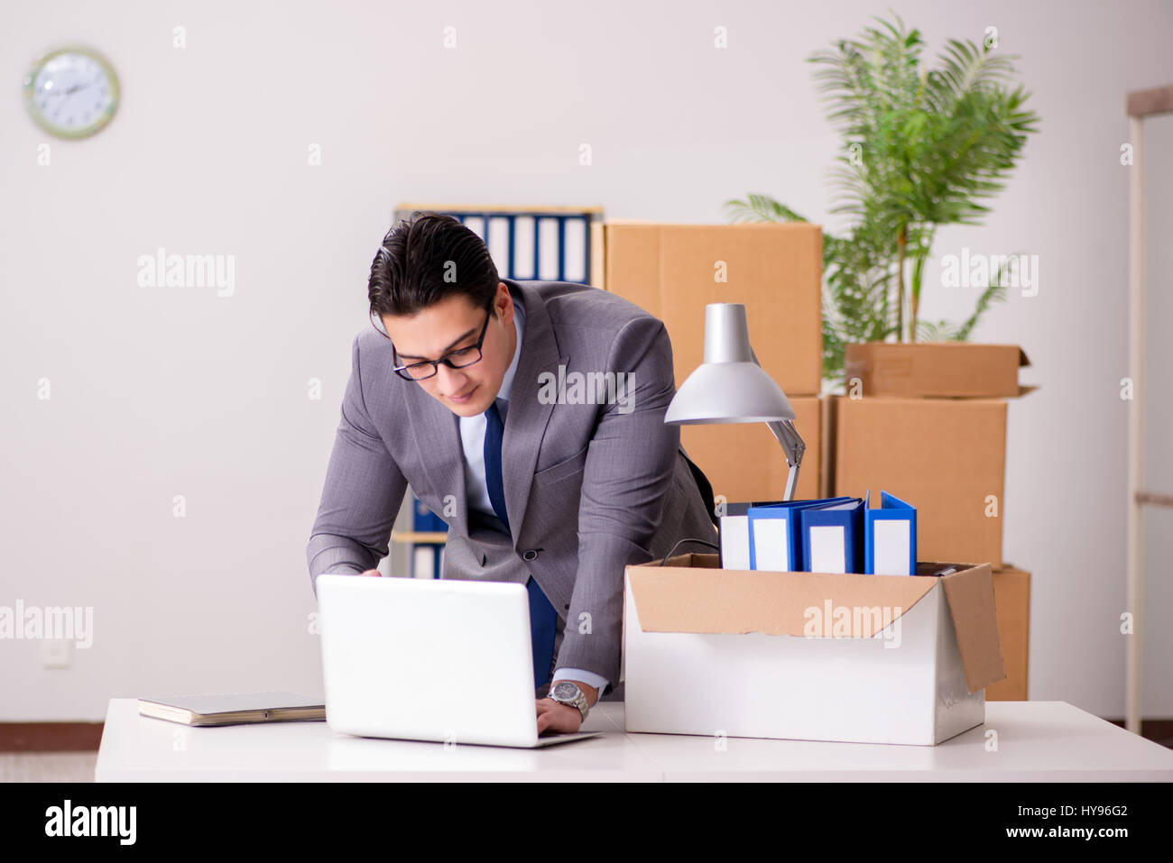 Young handsome businessman moving offices Stock Photo - Alamy