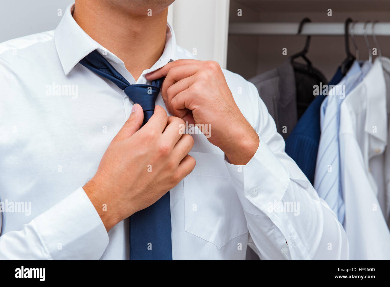 Businessman dressing up for work Stock Photo - Alamy