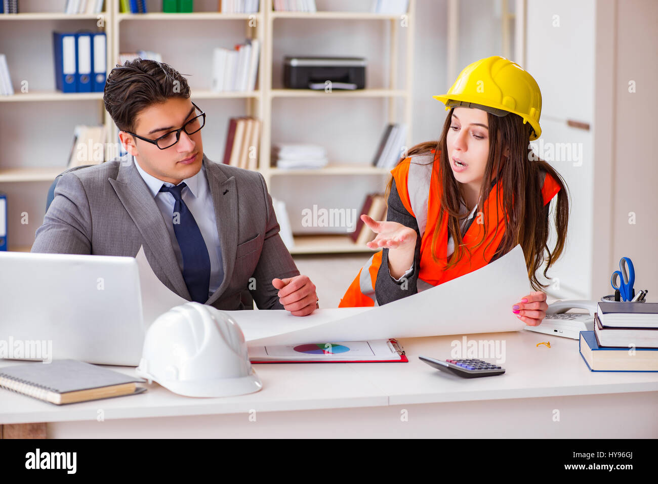 Construction foreman supervisor reviewing drawings Stock Photo - Alamy