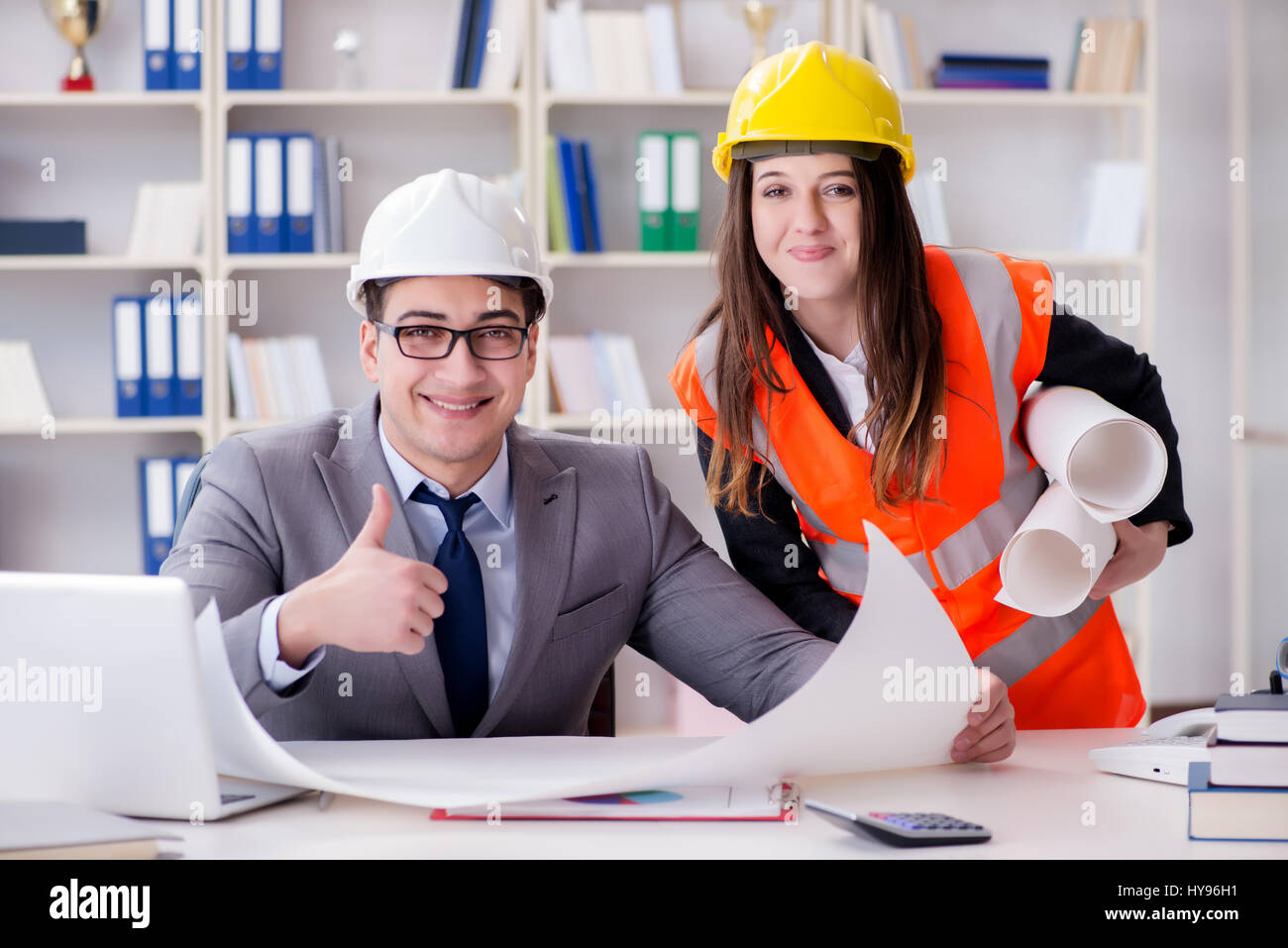 Construction foreman supervisor reviewing drawings Stock Photo - Alamy