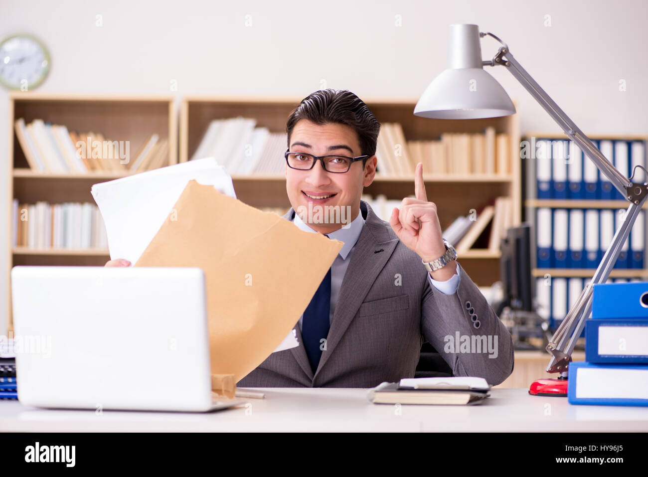 Businessman receiving letter in the office Stock Photo - Alamy