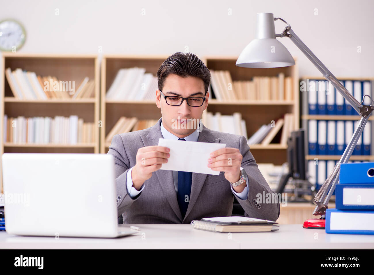 Businessman receiving letter in the office Stock Photo - Alamy