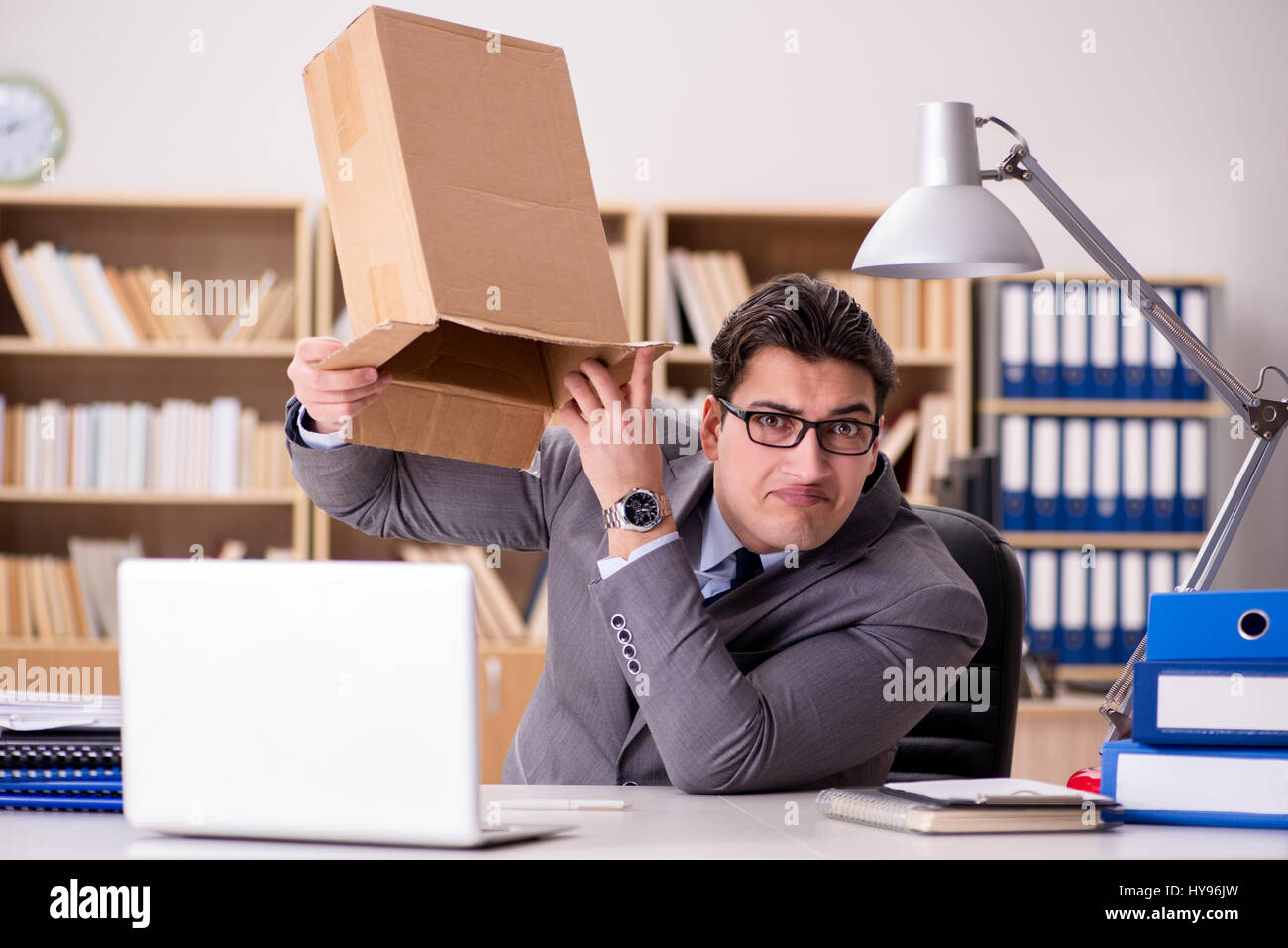 Businessman opening package in office hi-res stock photography and ...