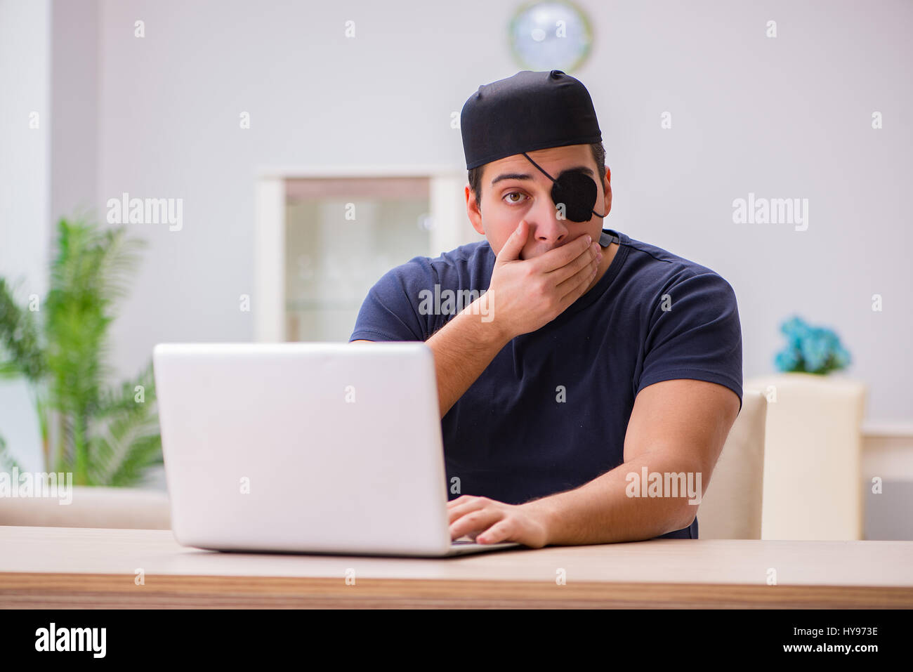 Digital security concept with pirate at computer Stock Photo - Alamy