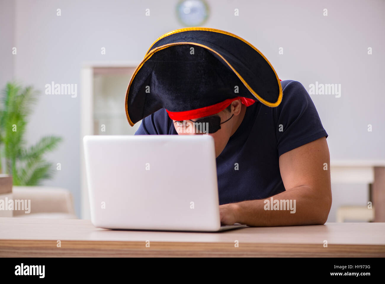 Digital security concept with pirate at computer Stock Photo - Alamy