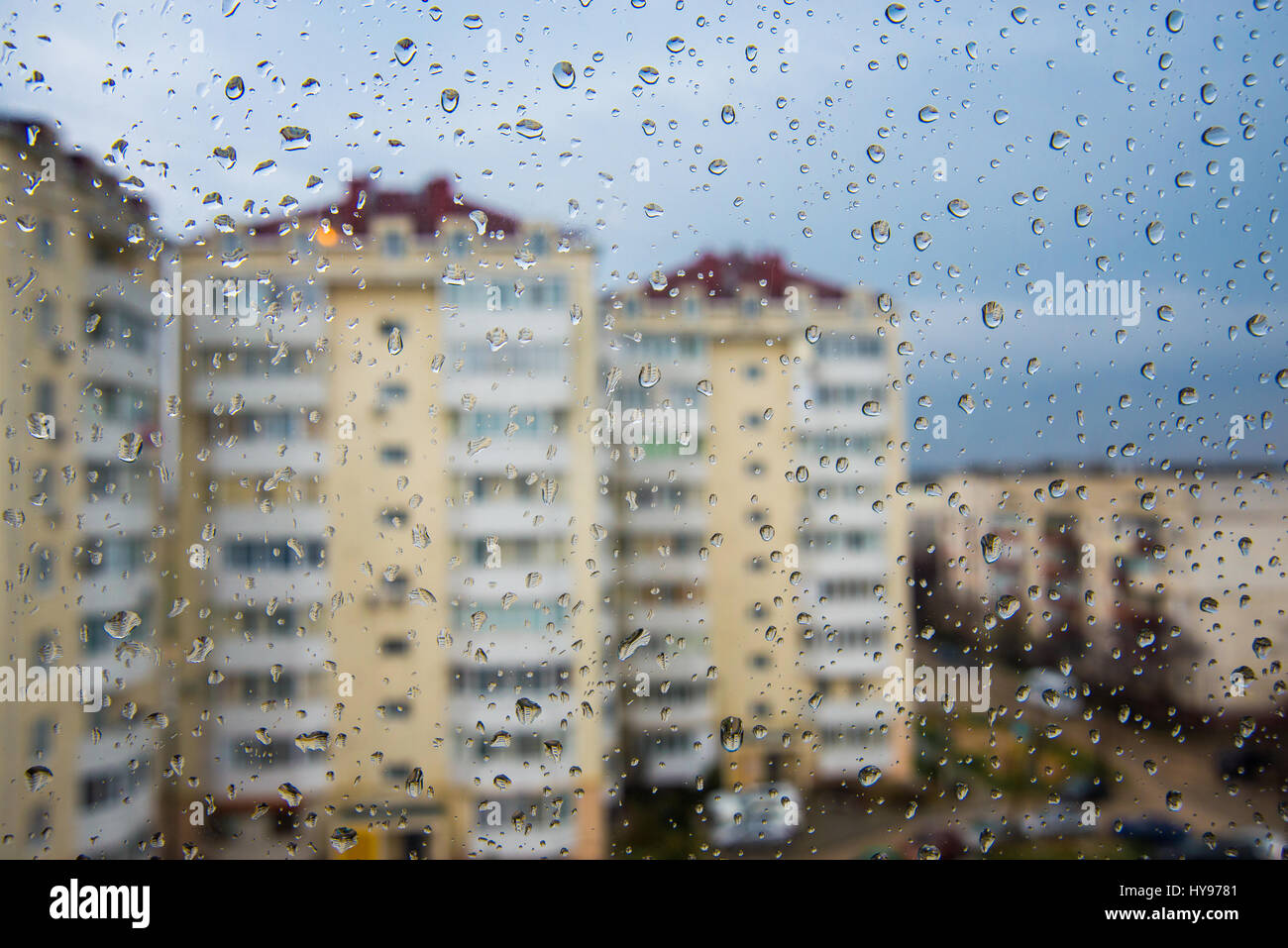 City view through a window on a rainy day Stock Photo - Alamy