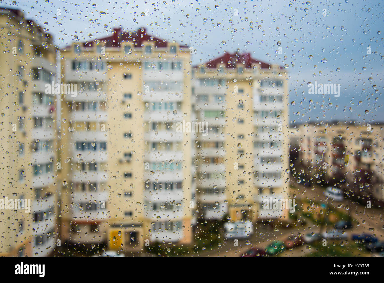 City view through a window on a rainy day Stock Photo - Alamy