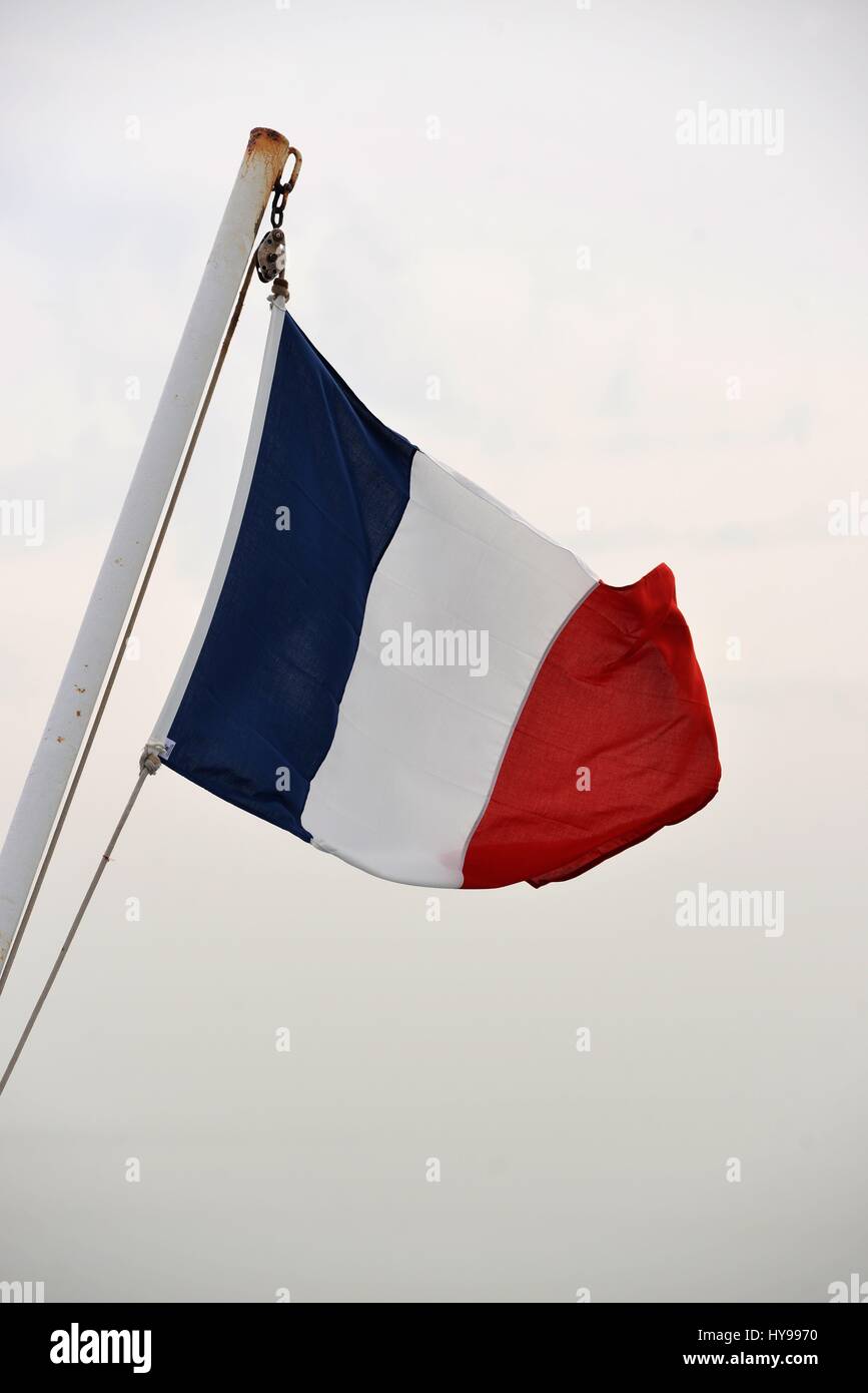 A french flag on a ship leaving french harbour Calais on June eleventh ...