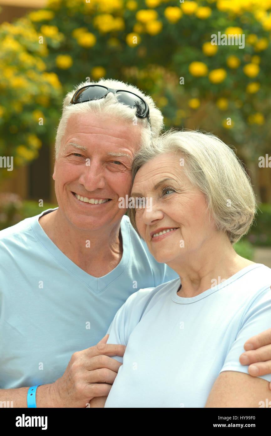 Happy elderly couple embracing Stock Photo - Alamy