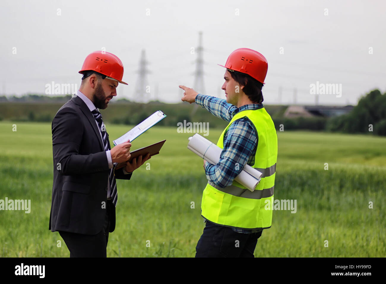 construction two man in the field Stock Photo - Alamy
