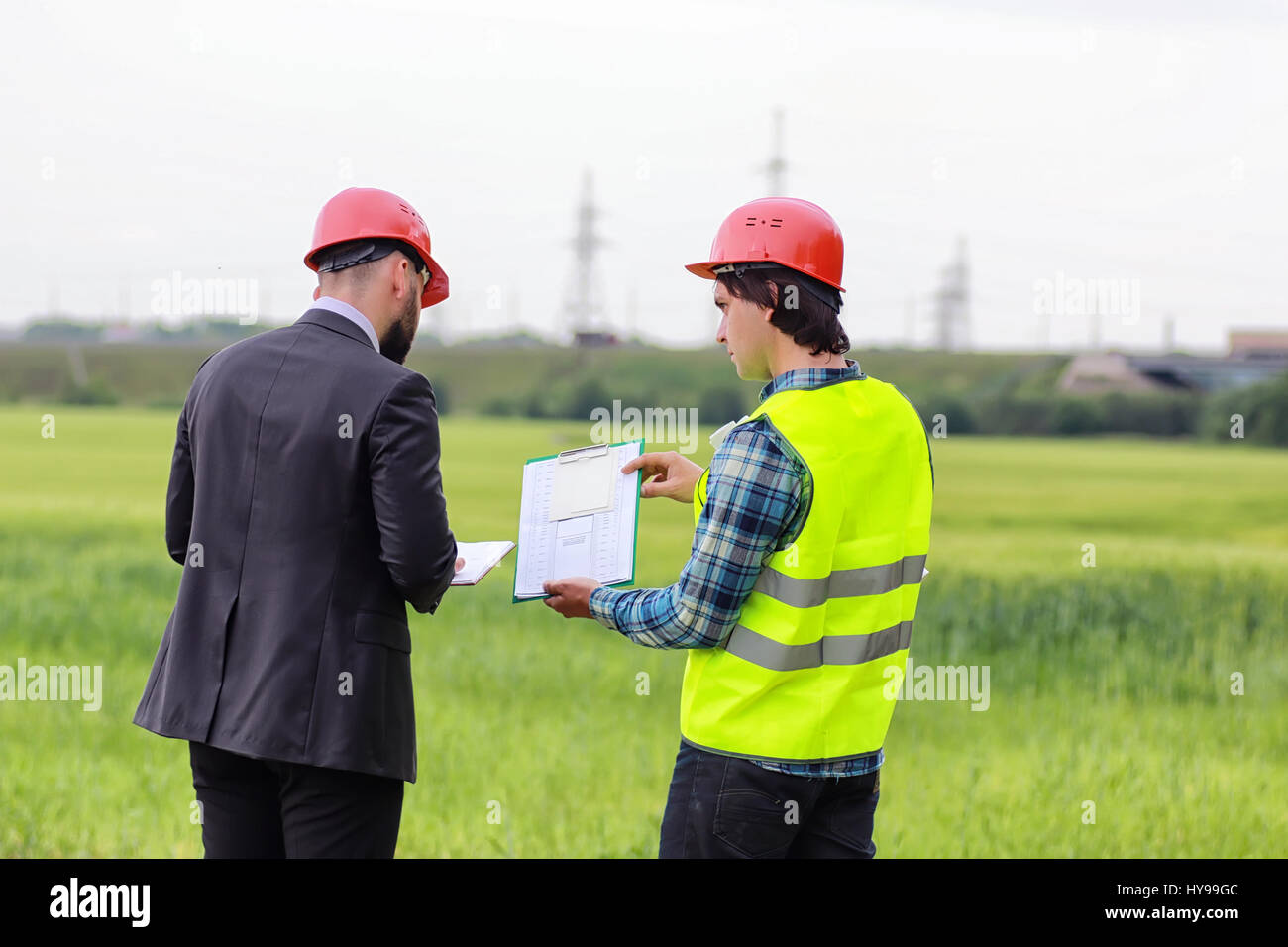 construction two man in the field Stock Photo - Alamy