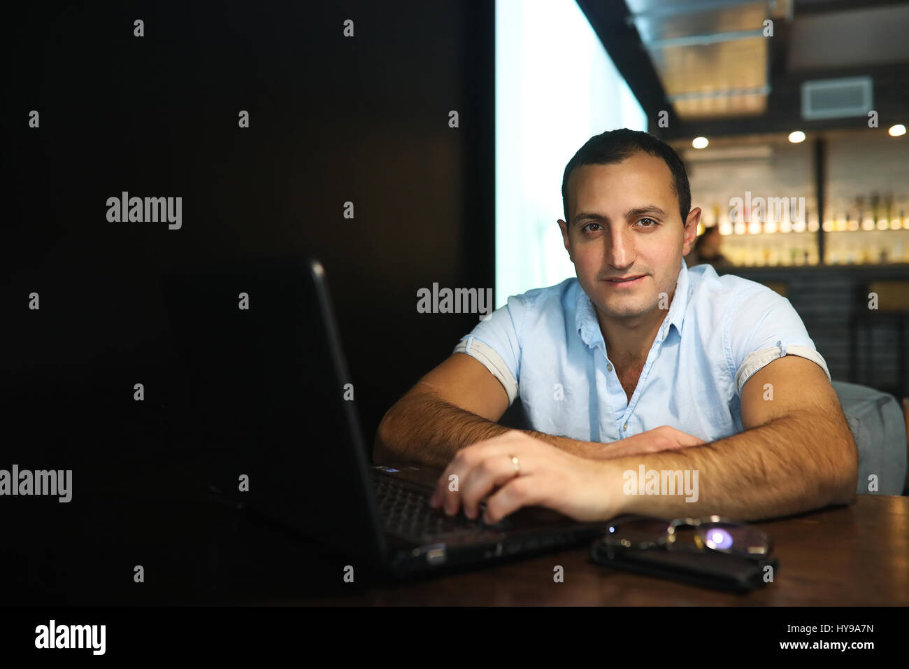 Armenian handsome man working behind laptop Stock Photo - Alamy