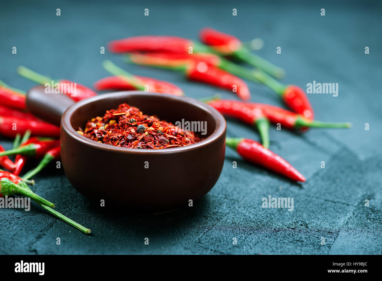 chilli peppers on the black table, chilli background Stock Photo - Alamy