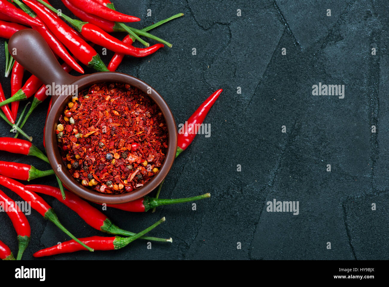 chilli peppers on the black table, chilli background Stock Photo - Alamy