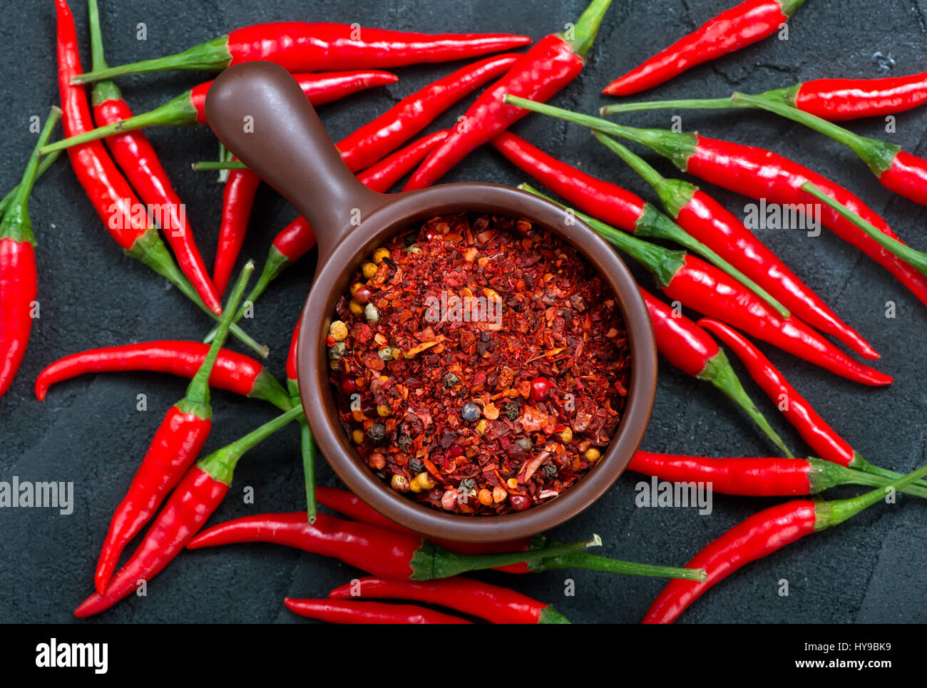 chilli peppers on the black table, chilli background Stock Photo - Alamy