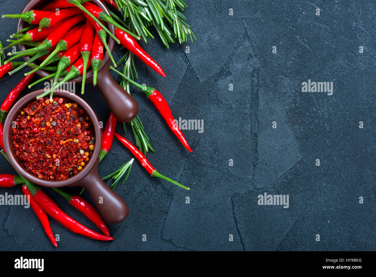 chilli peppers on the black table, chilli background Stock Photo - Alamy