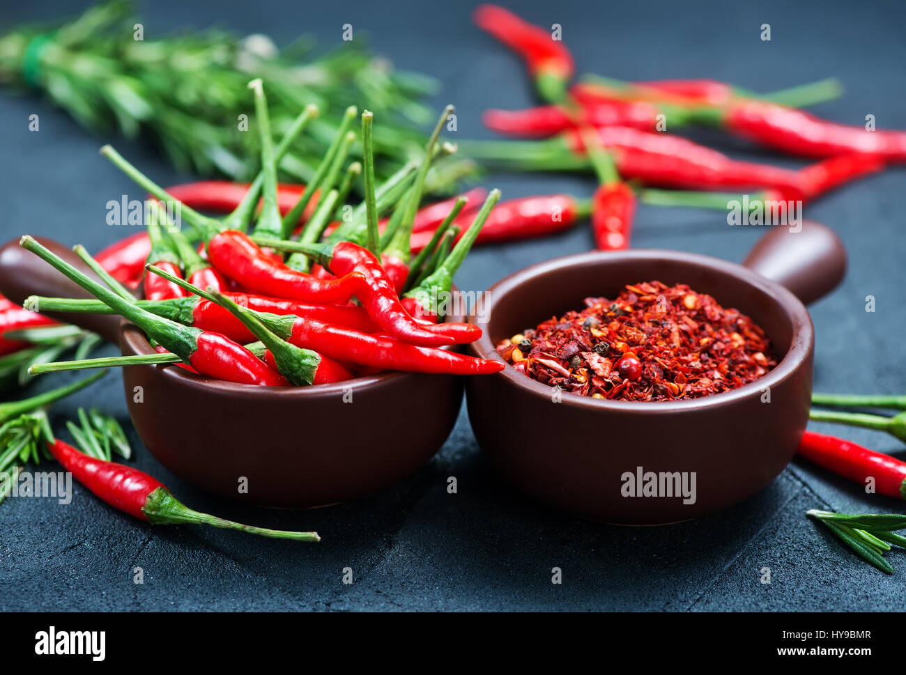 chilli peppers on the black table, chilli background Stock Photo - Alamy