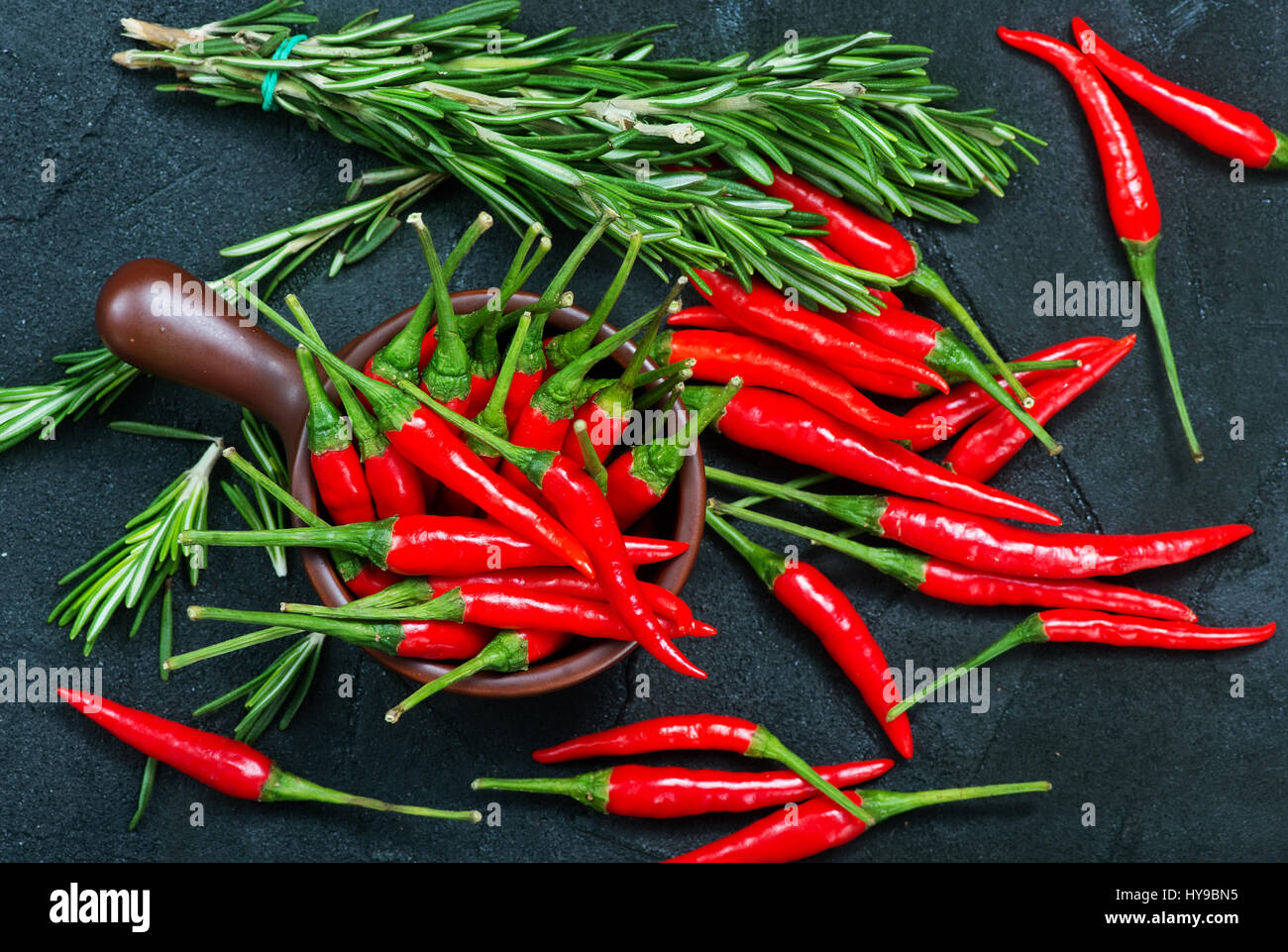 chilli peppers on the black table, chilli background Stock Photo - Alamy