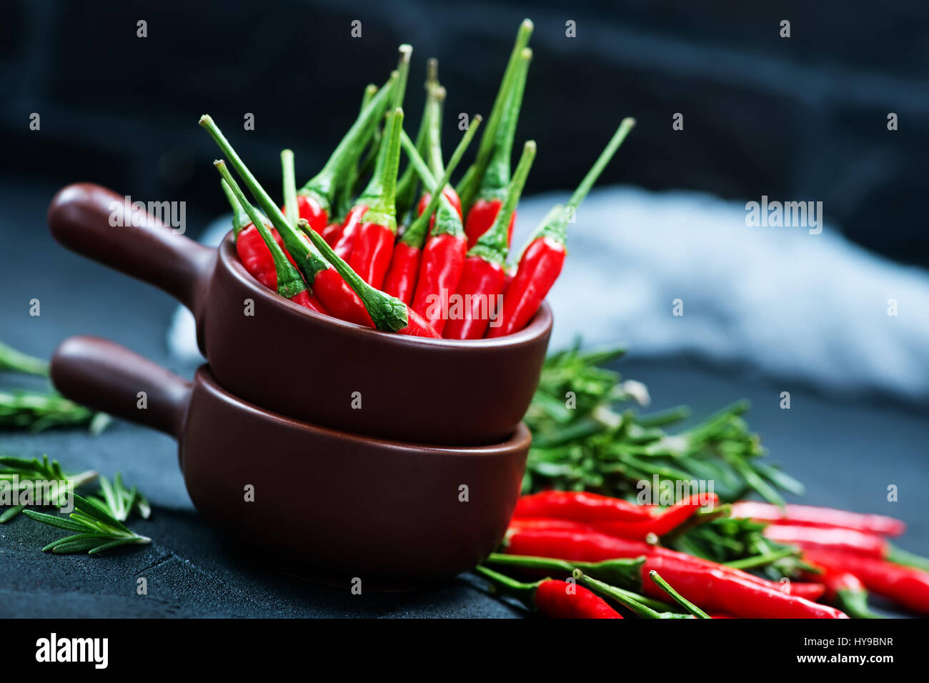 chilli peppers on the black table, chilli background Stock Photo - Alamy