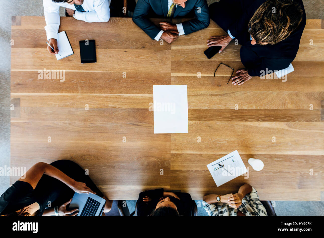 Top view of business colleagues discussing financial reports and ...
