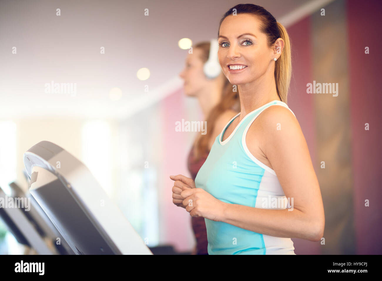 Mature woman on treadmill hi-res stock photography and images - Alamy