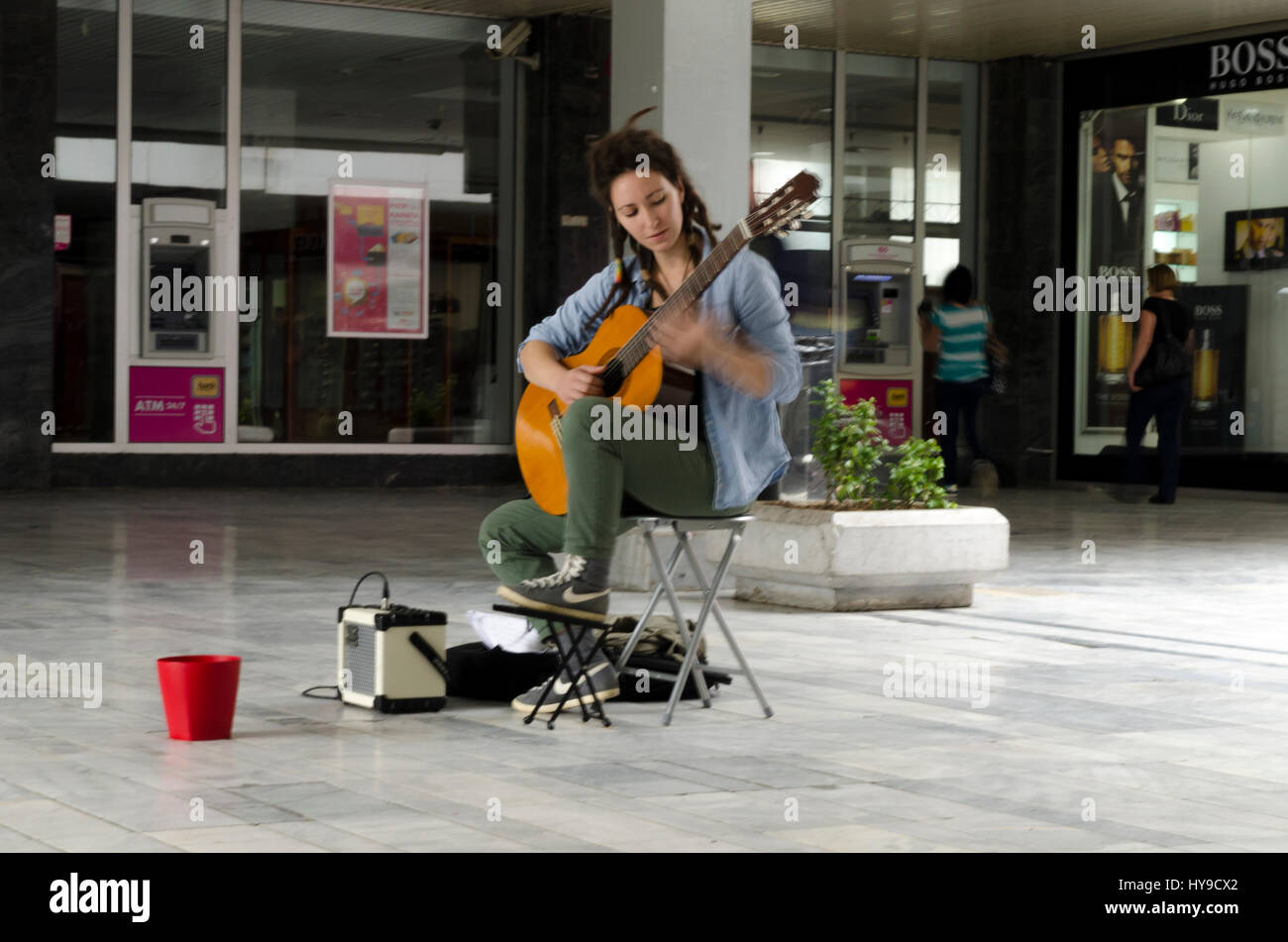 Female guitarist street musician hi-res stock photography and images ...