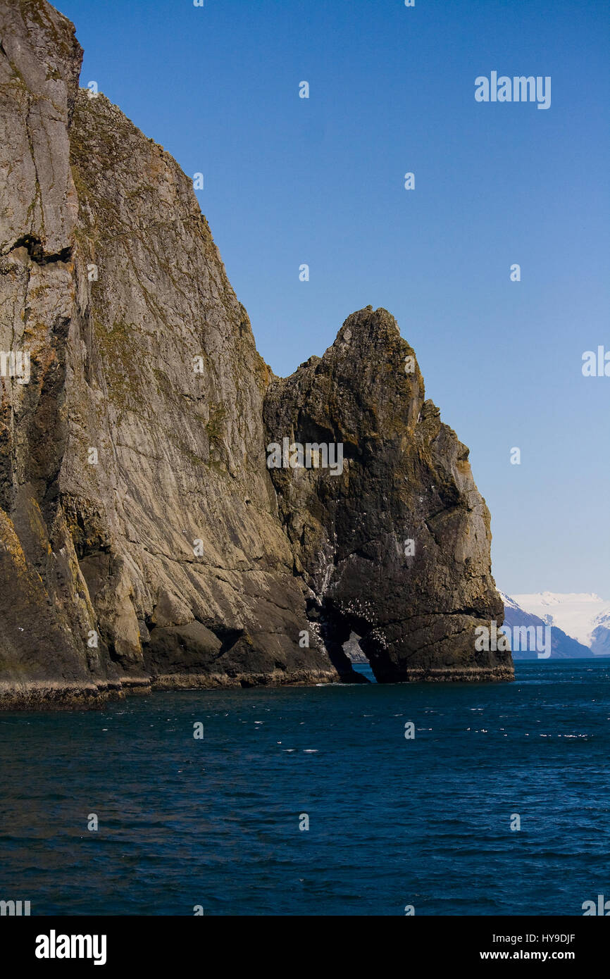 An interesting rock formation juts out of the ocean near Seward, Alaska ...