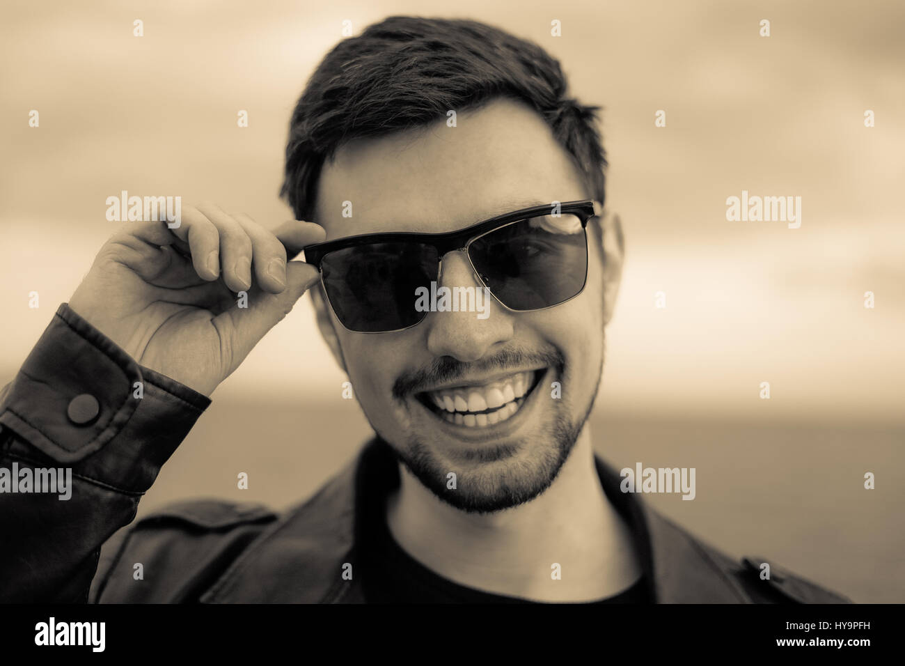 Vintage retro photo. Smiling man in sunglasses Stock Photo - Alamy