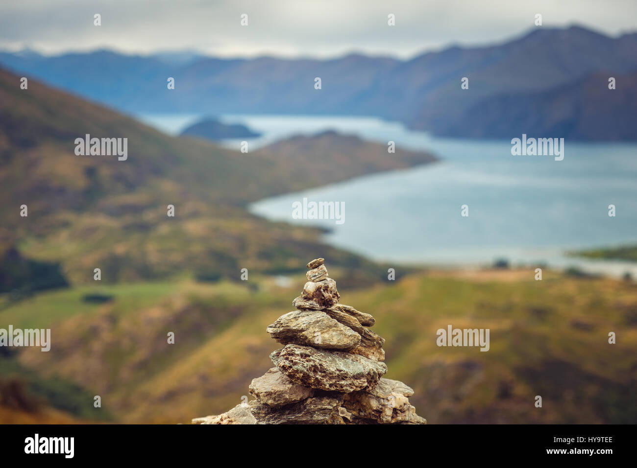 Landscape view of rock pyramid with mountains background, Lake Wanaka ...
