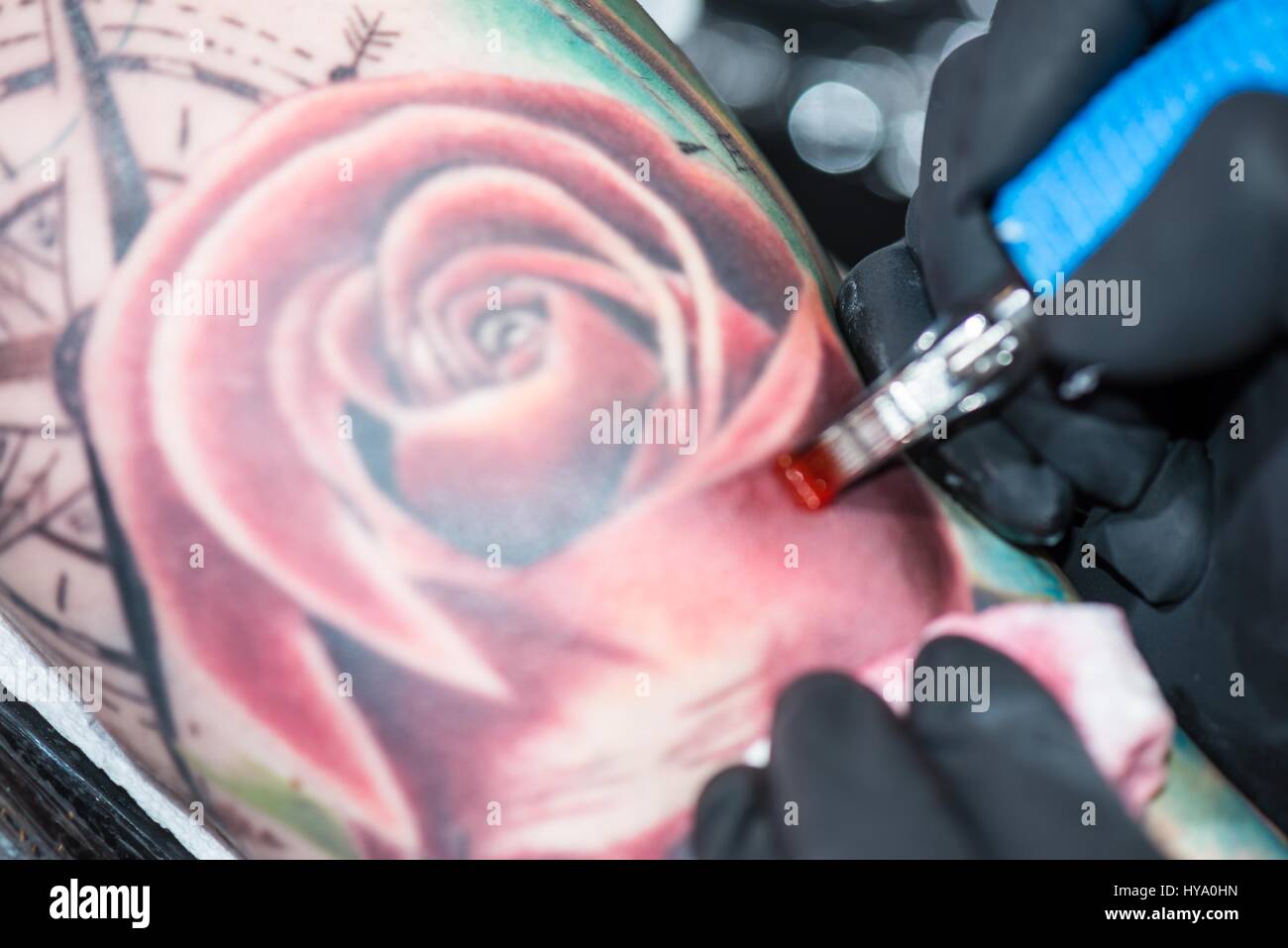 Close-up of tattooing Stock Photo - Alamy