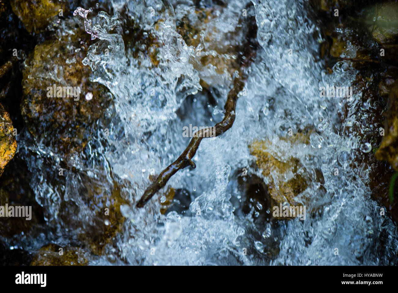 Waterfall splashes in closeup. abstract texture of water with bubbles ...