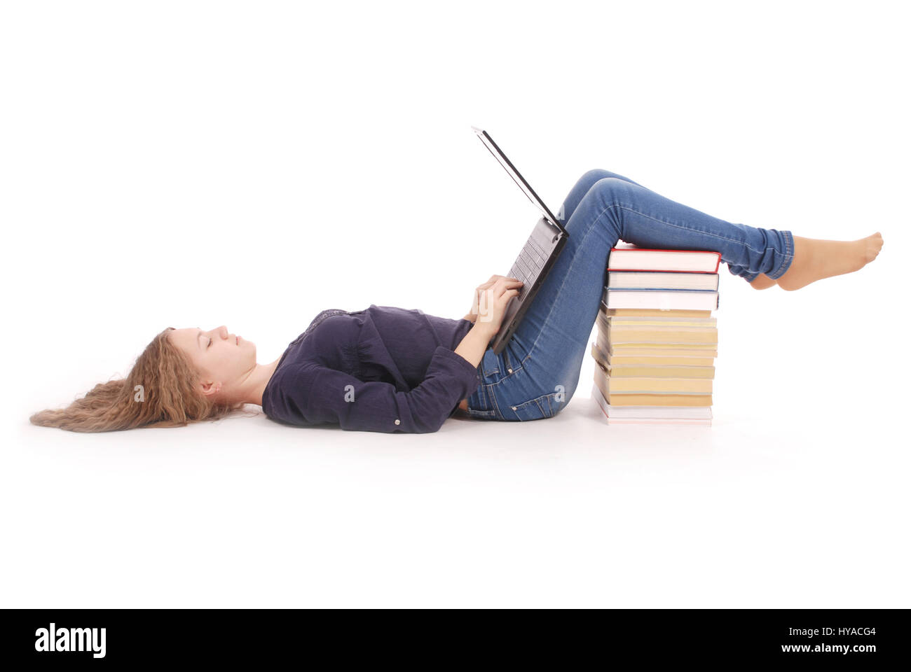 Student teenage girl lying sideways on the floor with laptop isolated ...