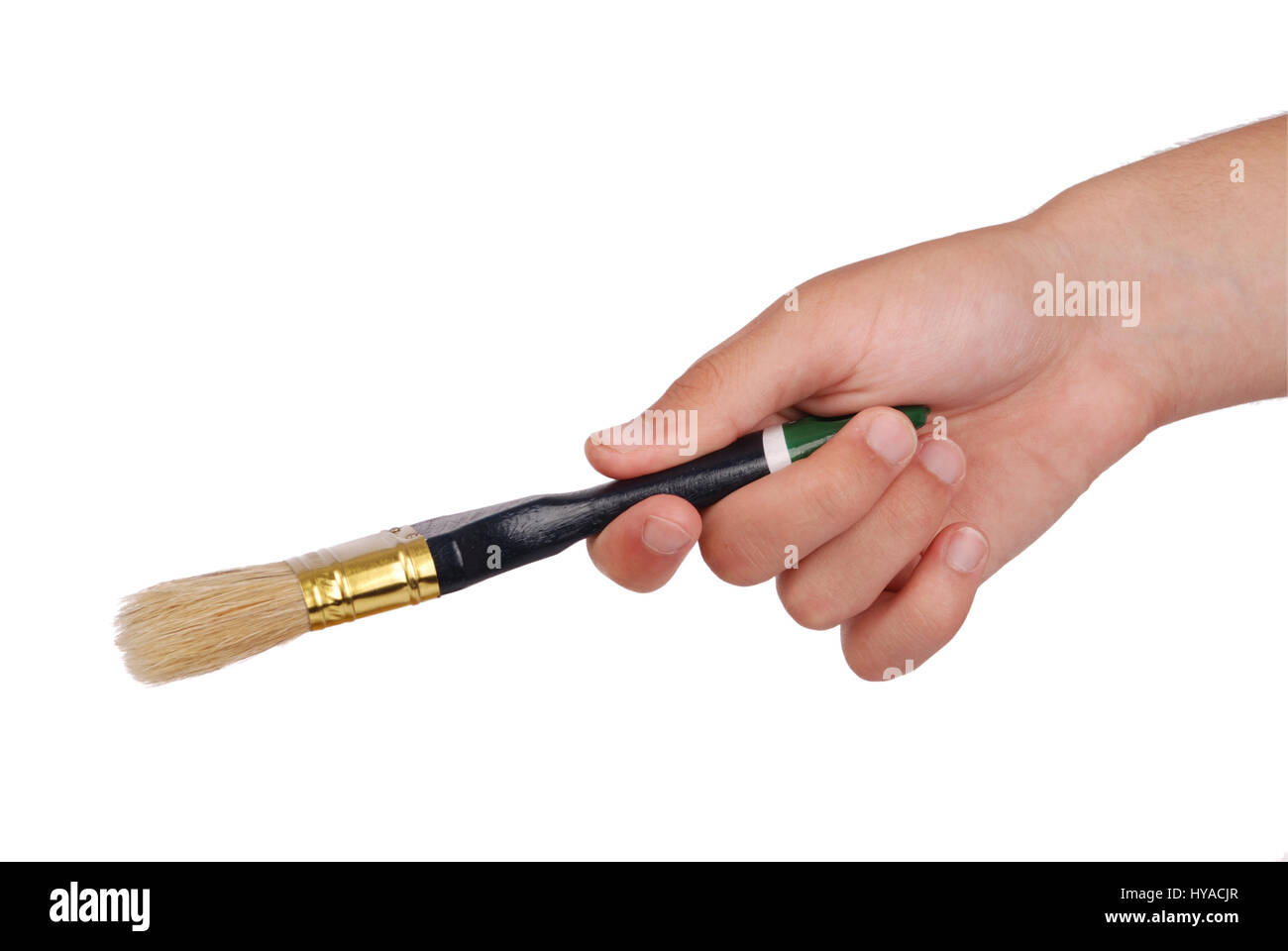 Yellow paint splashing out of brush which keeps the arm. Isolated on ...