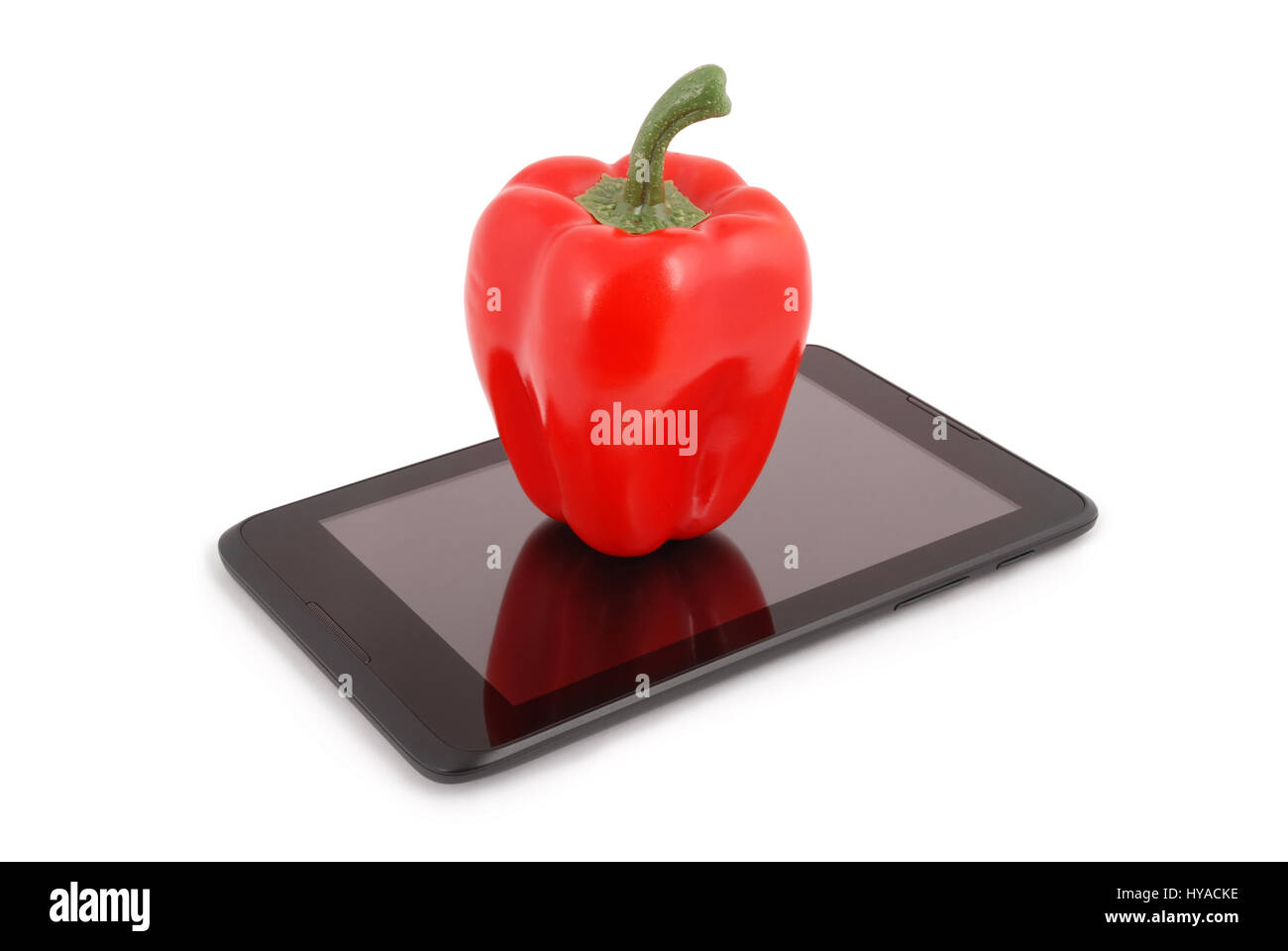 Red pepper on a tablet PC. Photo with clipping path Stock Photo - Alamy
