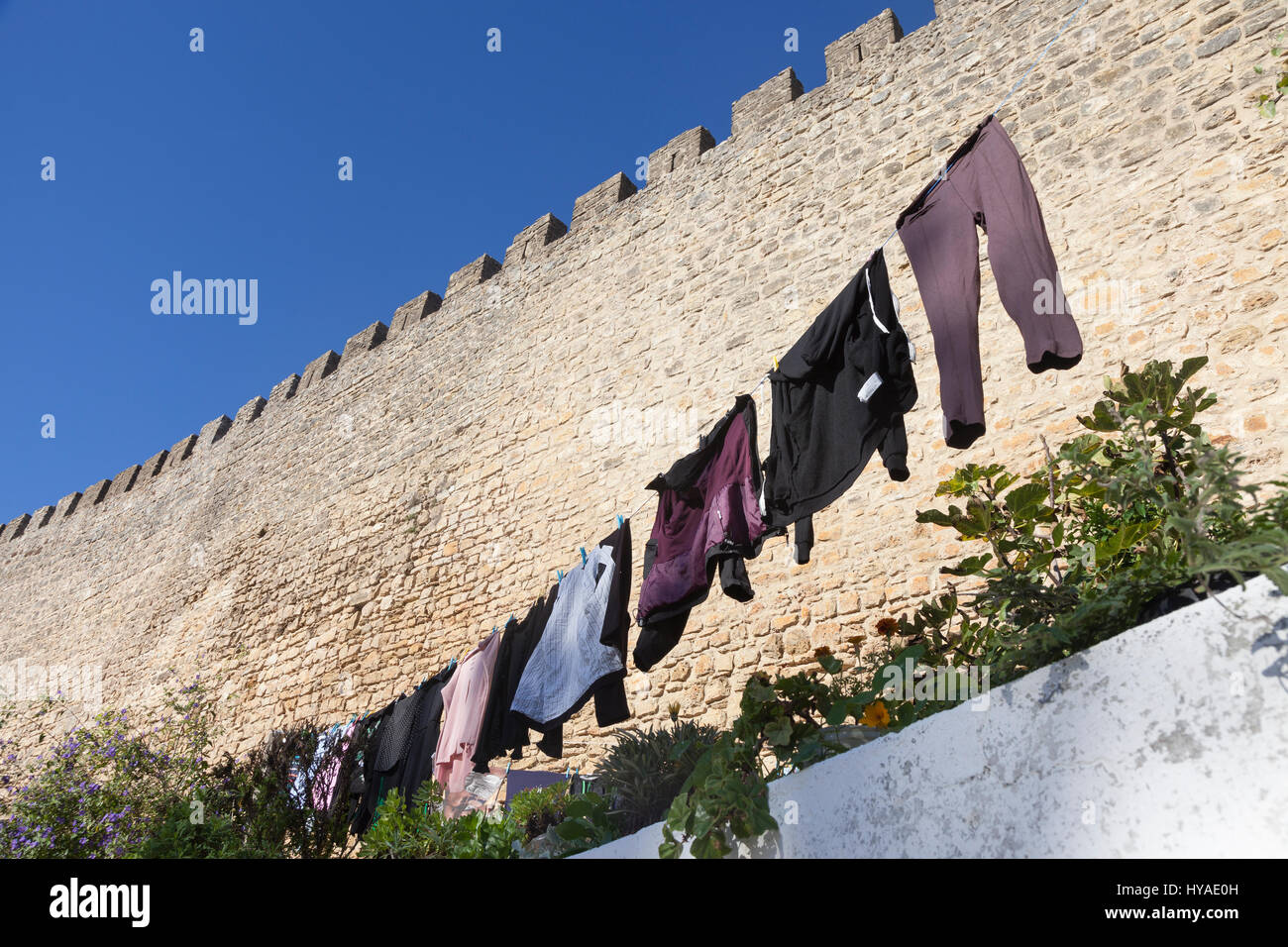 Óbidos, Portugal: Laundry hung to dry along the medieval wall of the ...