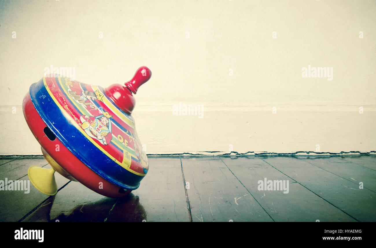 vintage spinning top on wooden floor Stock Photo - Alamy