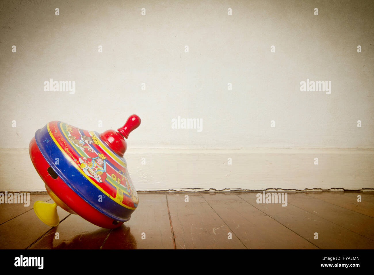 vintage spinning top on wooden floor Stock Photo - Alamy