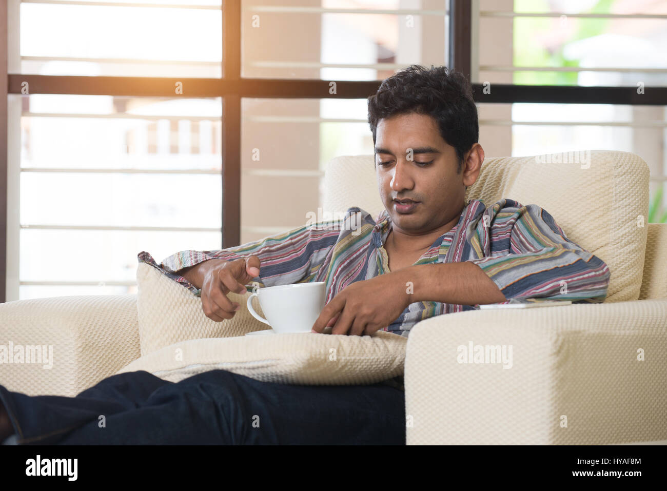 Indian male drinking coffee hi-res stock photography and images - Alamy