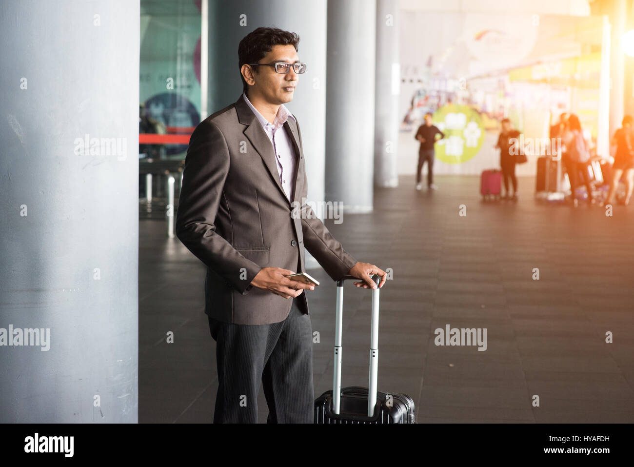 indian male walking at airport Stock Photo - Alamy