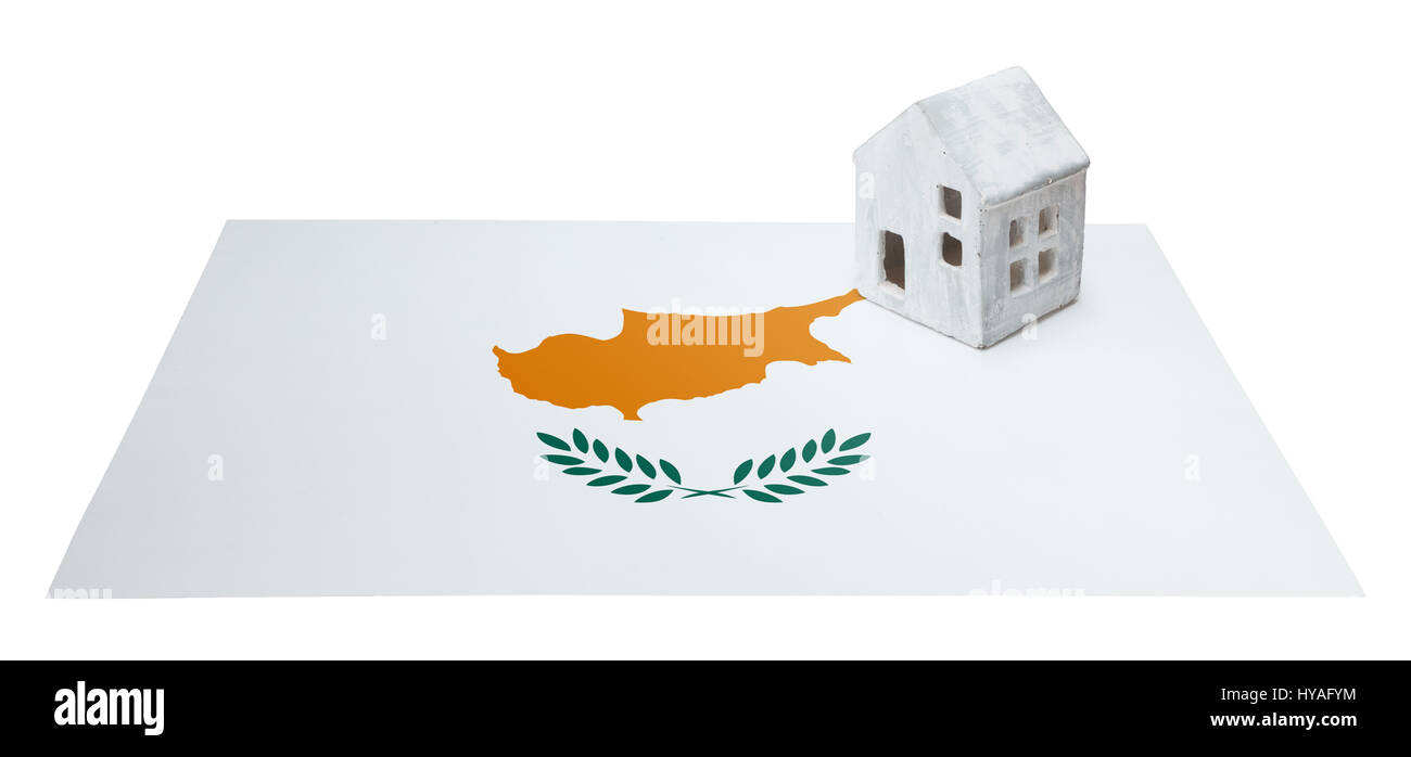 Small house on a flag - Living or migrating to Cyprus Stock Photo - Alamy