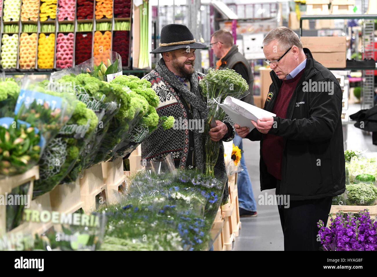 EDITORIAL USE ONLY (Left to right) Flower trader, Andy Noble and ...