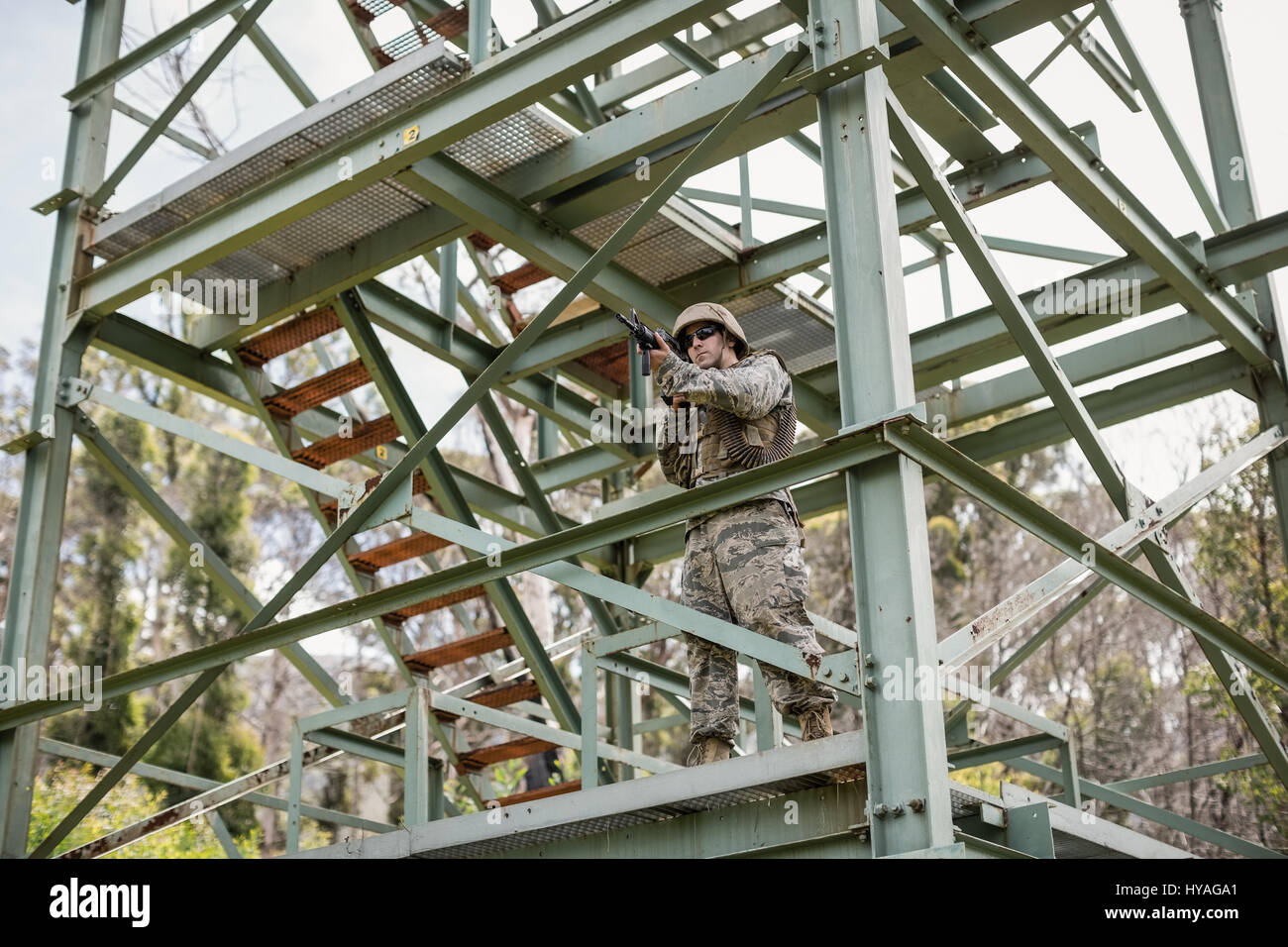 Military soldier guarding with a rifle in boot camp Stock Photo - Alamy