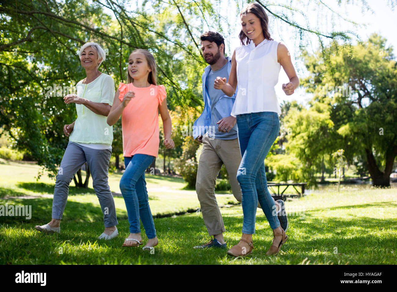 Family running on the park hi-res stock photography and images - Alamy
